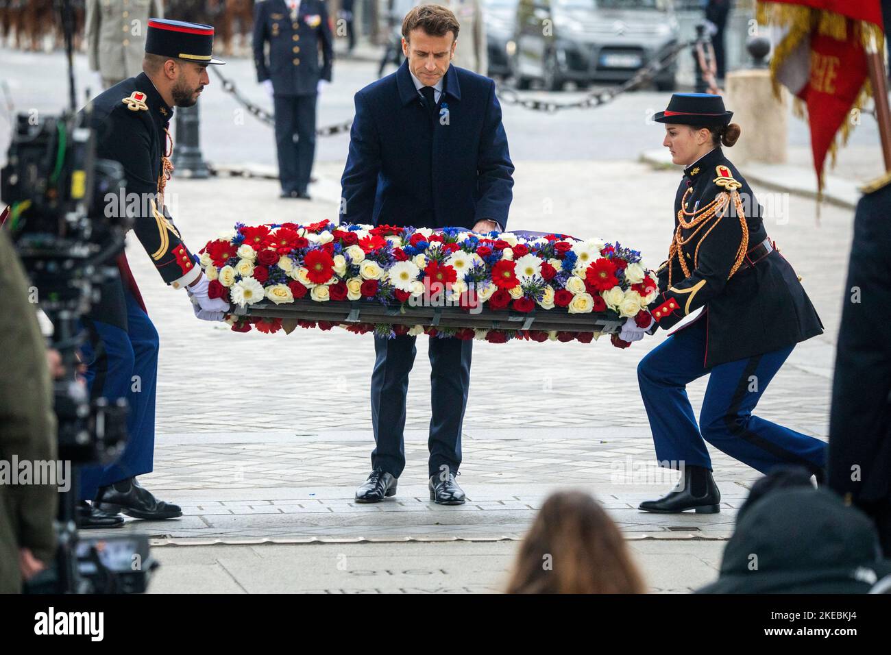 French President Emmanuel Macron lays a wreath of flowers during a ...