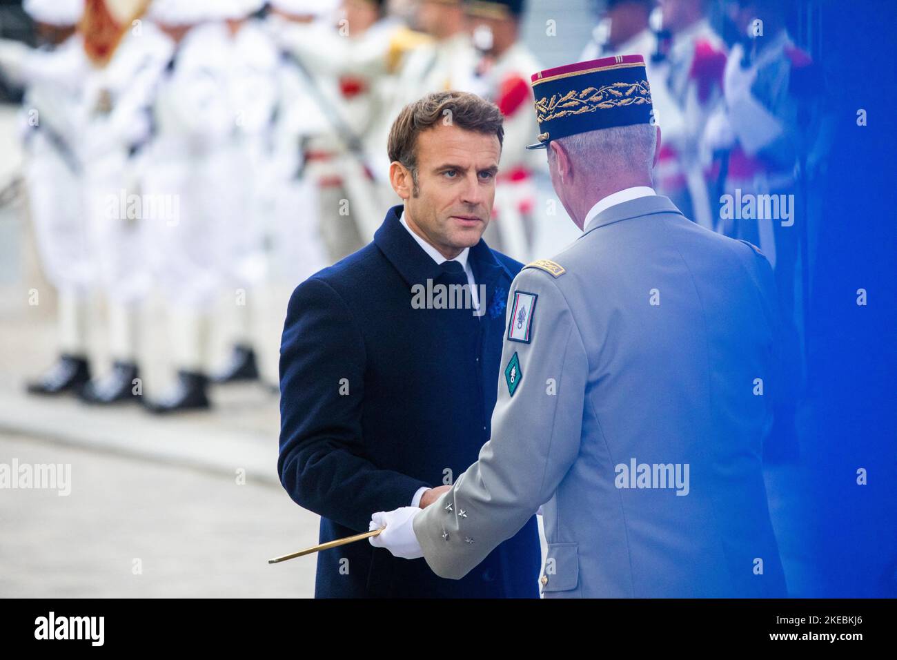 French President Emmanuel Macron lays a wreath of flowers during a ...