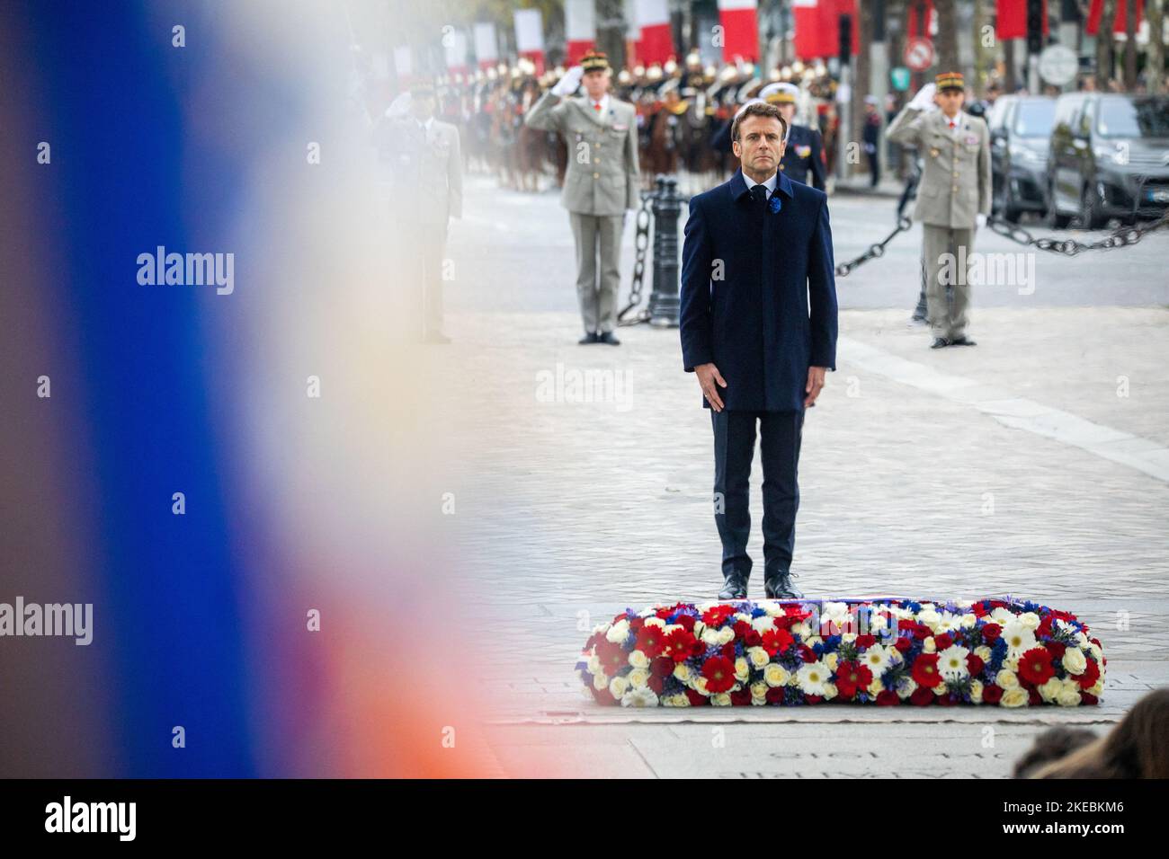 French President Emmanuel Macron lays a wreath of flowers during a ...