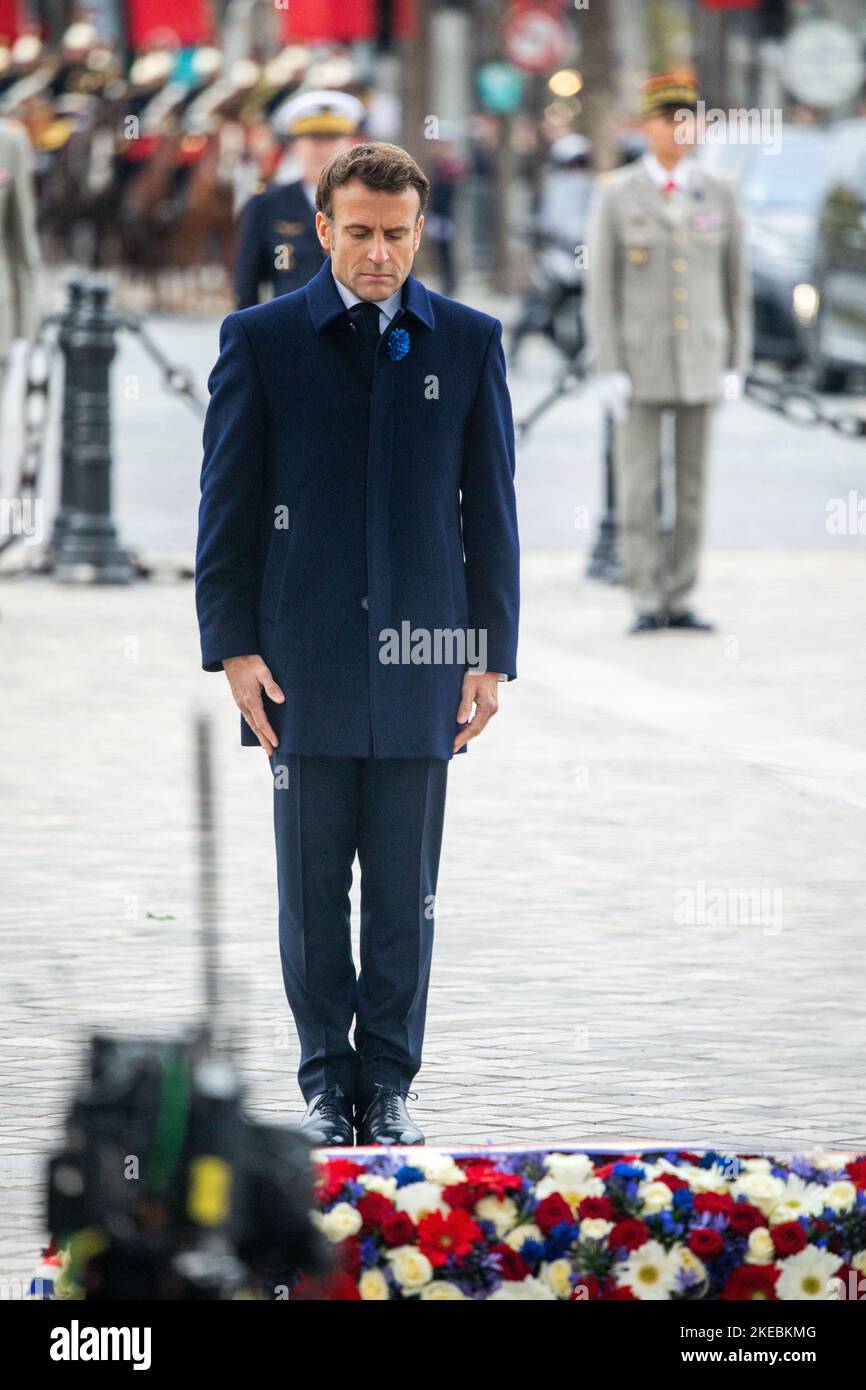 French President Emmanuel Macron lays a wreath of flowers during a ...