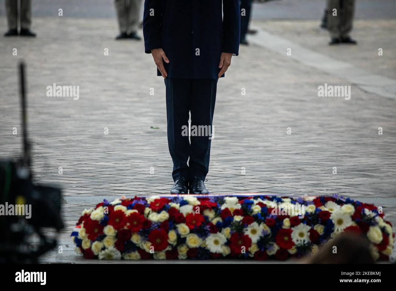 French President Emmanuel Macron lays a wreath of flowers during a ...