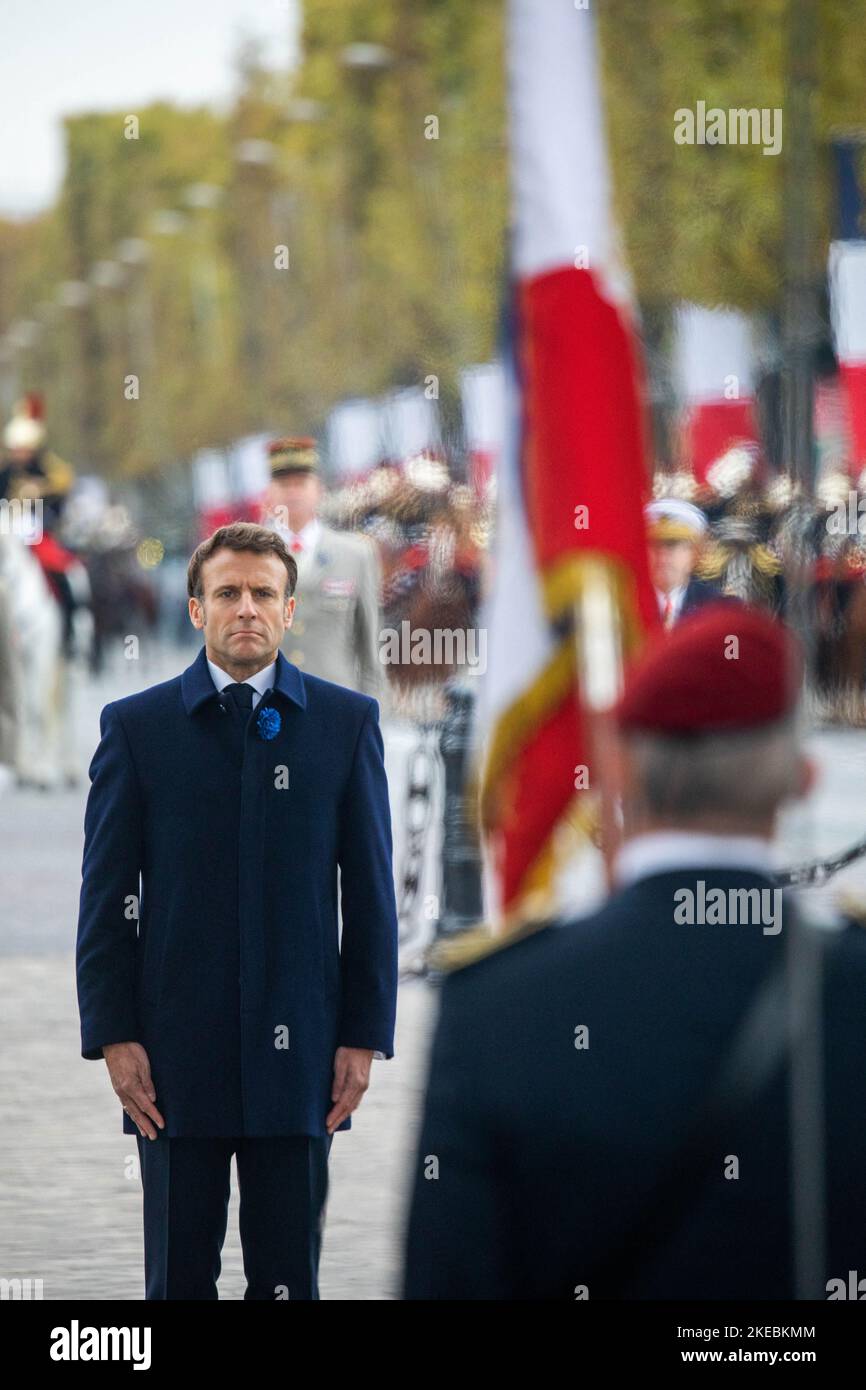 French President Emmanuel Macron lays a wreath of flowers during a ...