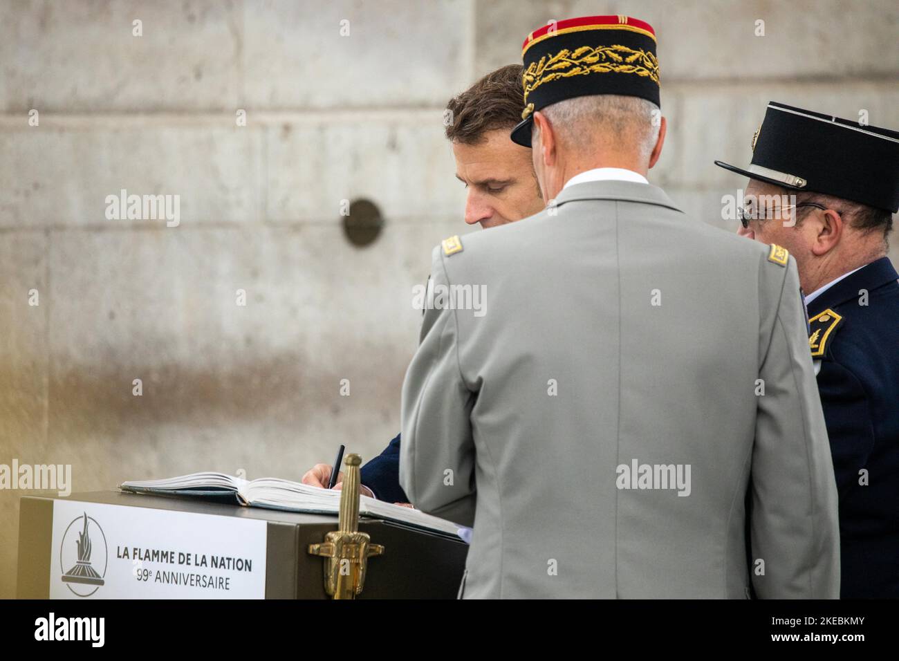 French President Emmanuel Macron lays a wreath of flowers during a ...
