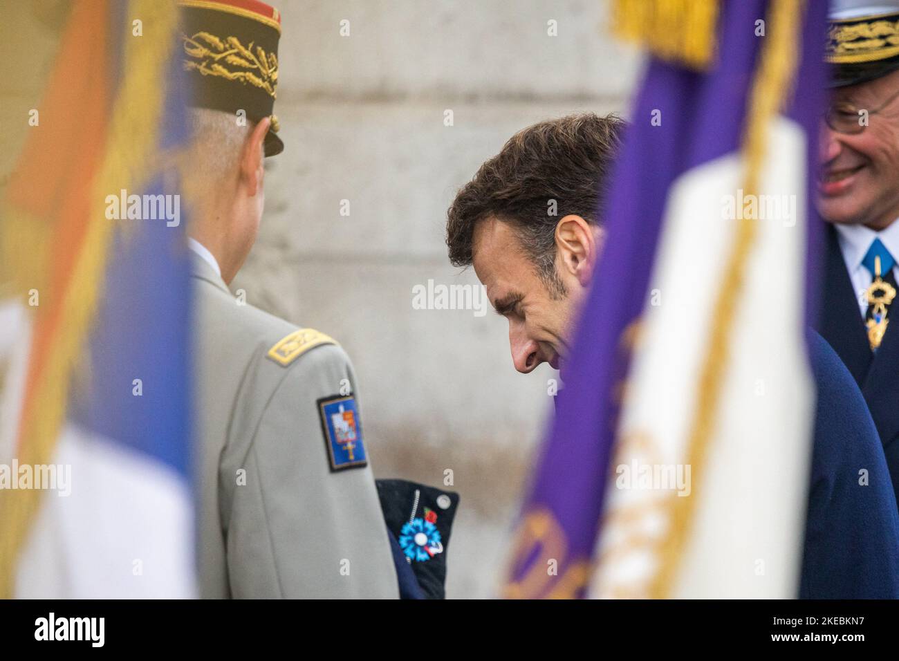 French President Emmanuel Macron lays a wreath of flowers during a ...