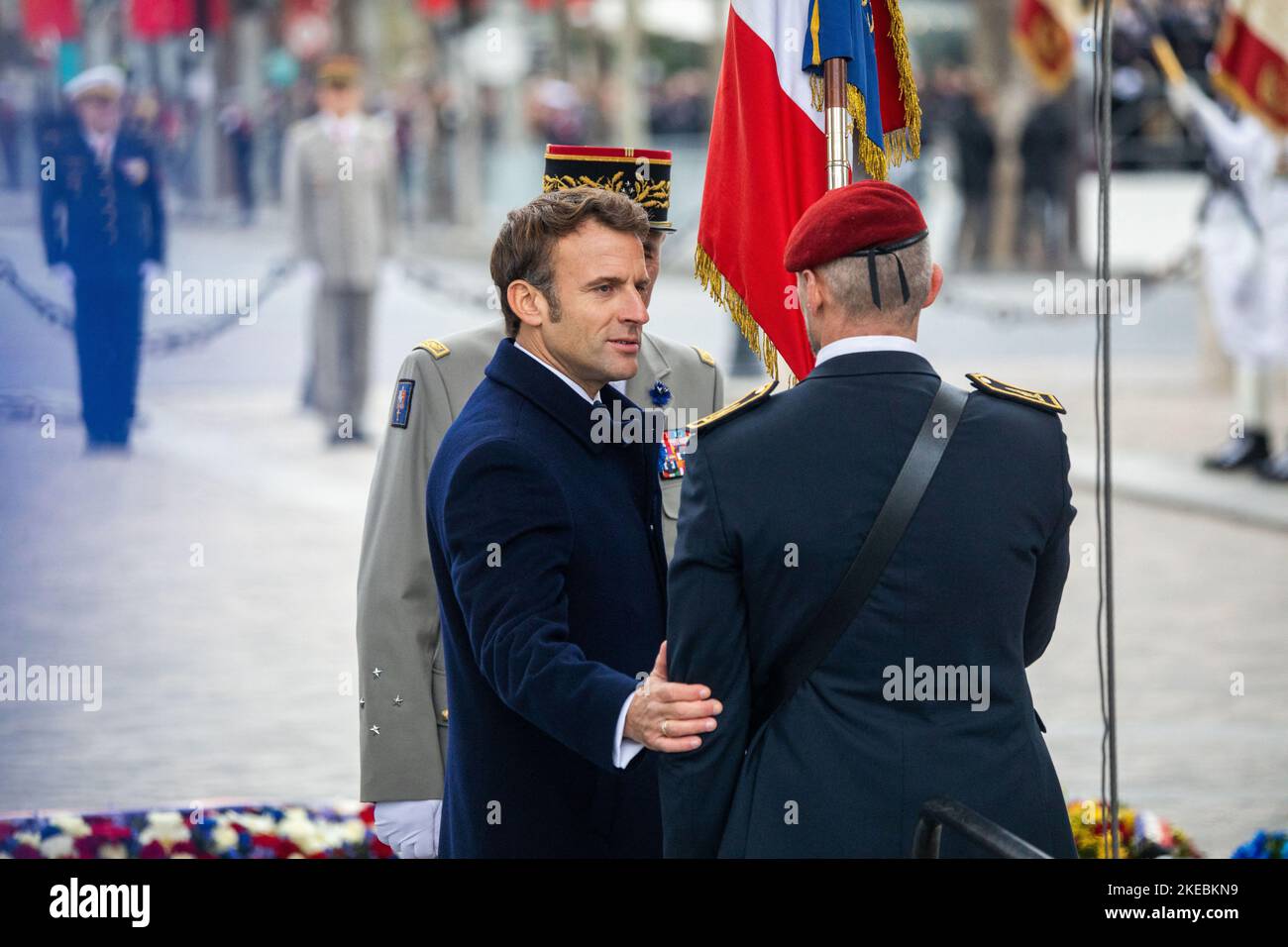 French President Emmanuel Macron lays a wreath of flowers during a ...