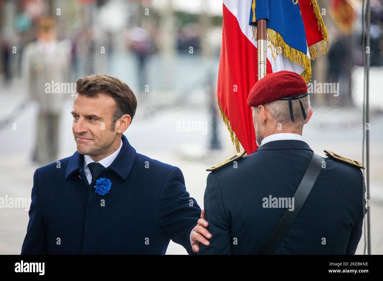 French President Emmanuel Macron lays a wreath of flowers during a ...