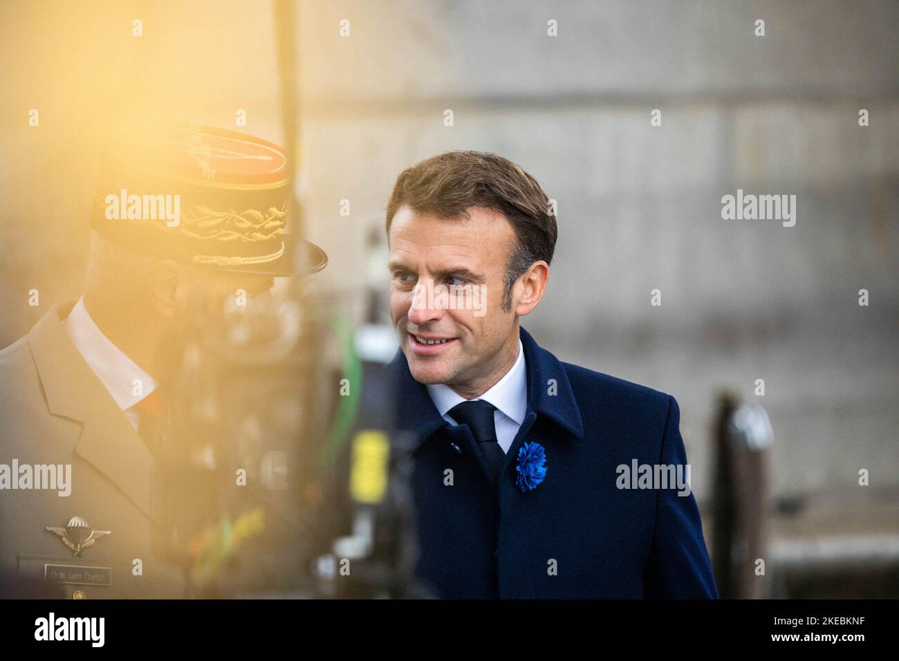 French President Emmanuel Macron lays a wreath of flowers during a ...