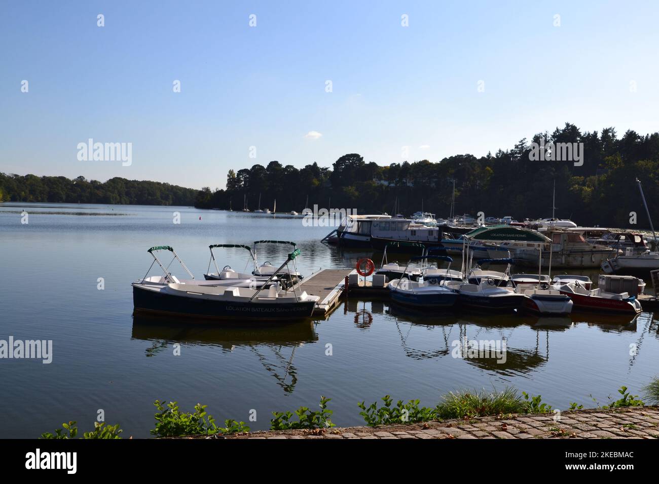 Small boats on a river Stock Photo - Alamy
