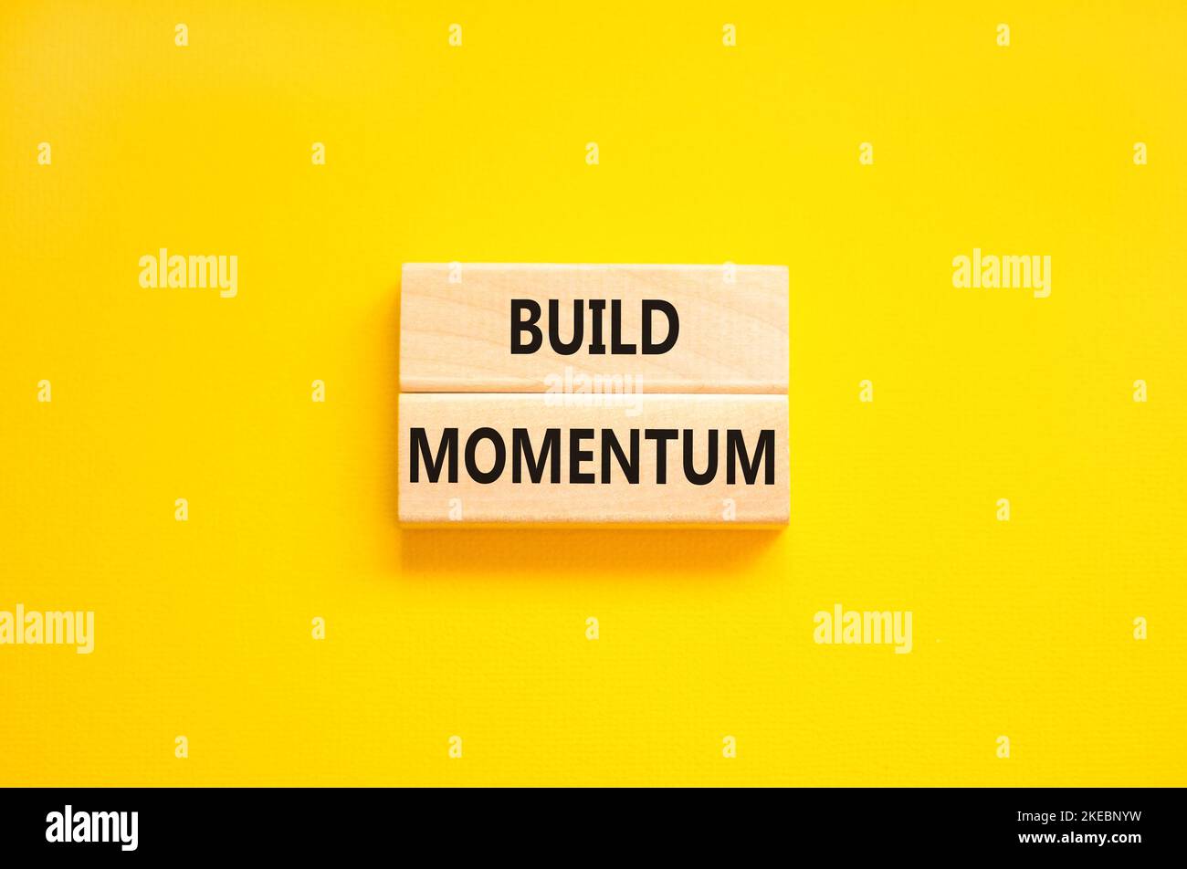 Build momentum symbol. Concept words Build momentum on wooden blocks ...