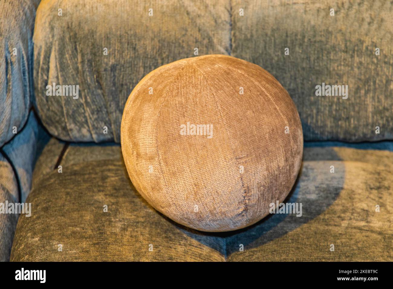 Trendy Stylish Textile Ball Shape Pillow at Sofa Stock Photo - Alamy