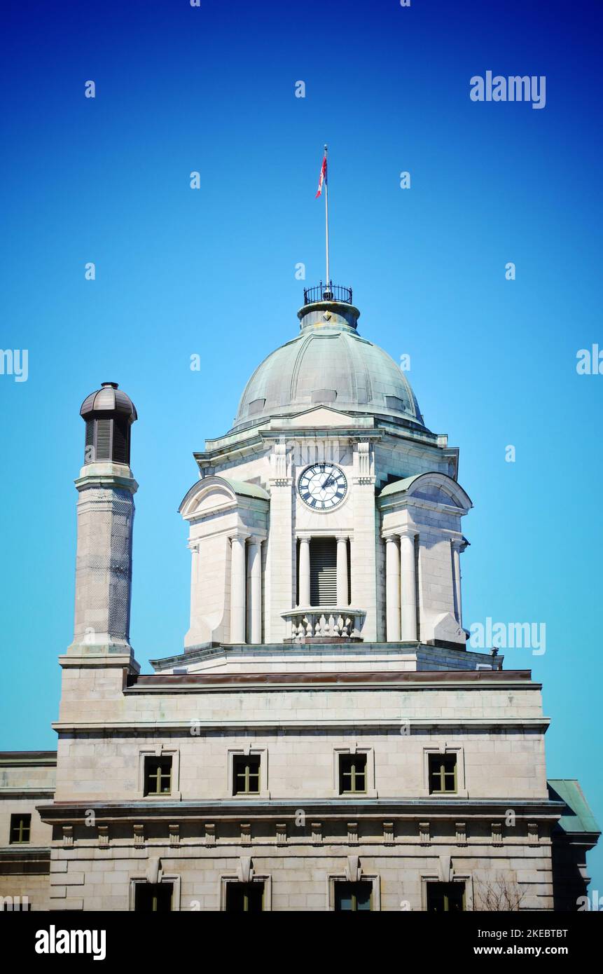A vertical shot of dome and clock tower of the old Louis St Laurent ...