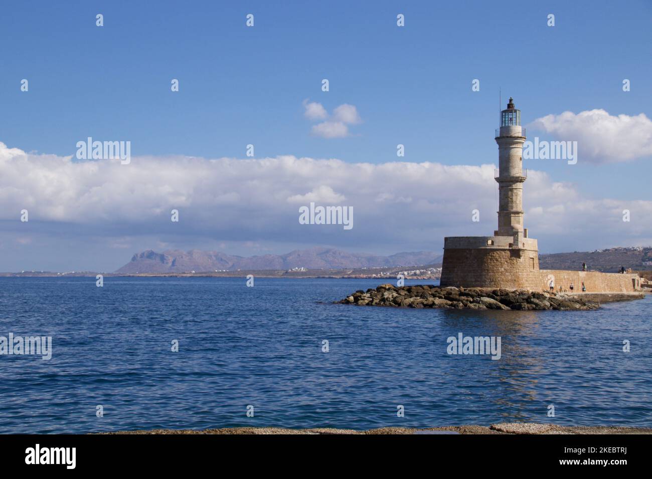The lighthouse and entrance to Chania old harbor Stock Photo - Alamy