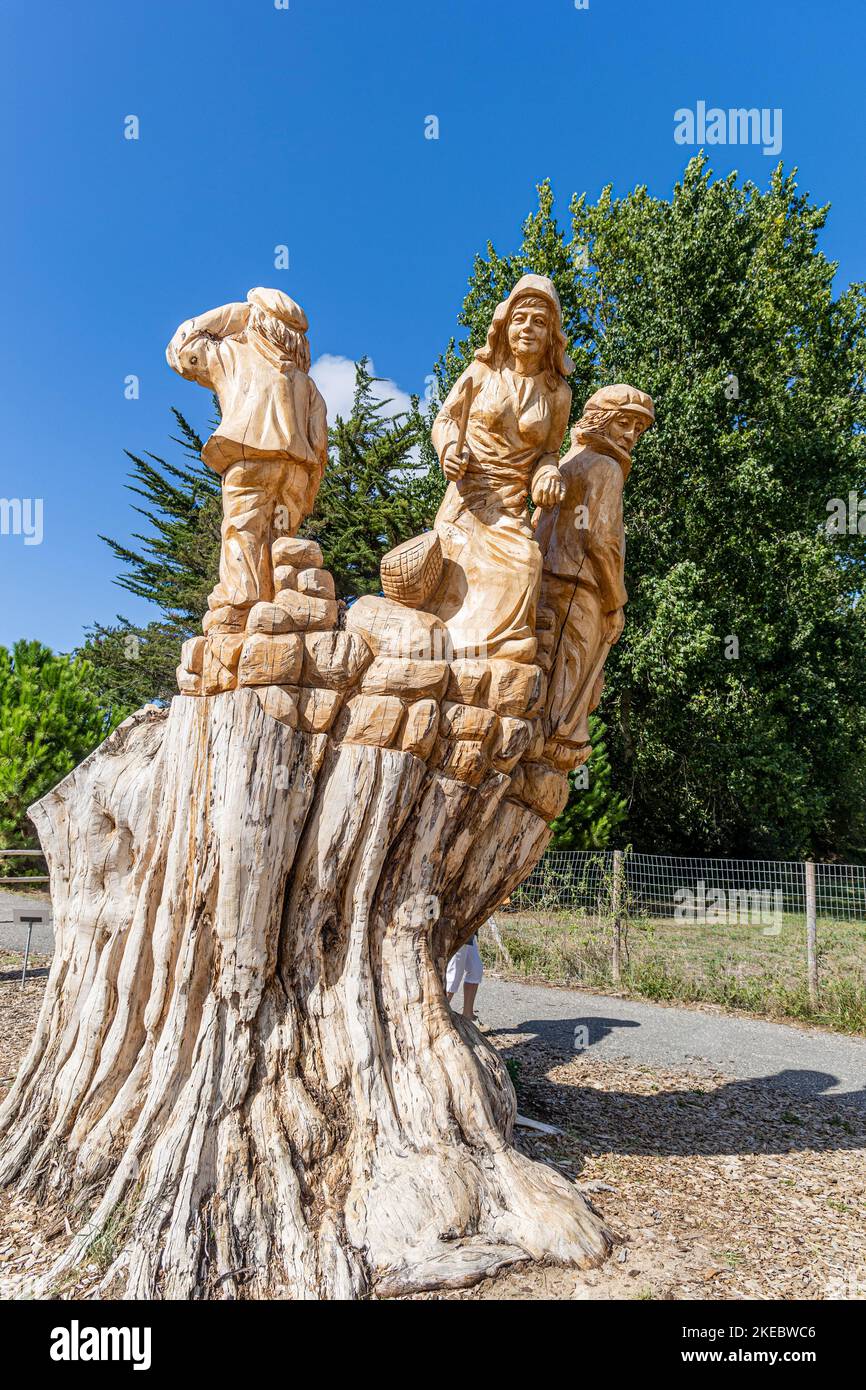 Wood carving from a tree trunk on the roadside at Chaucre, Ile d ...