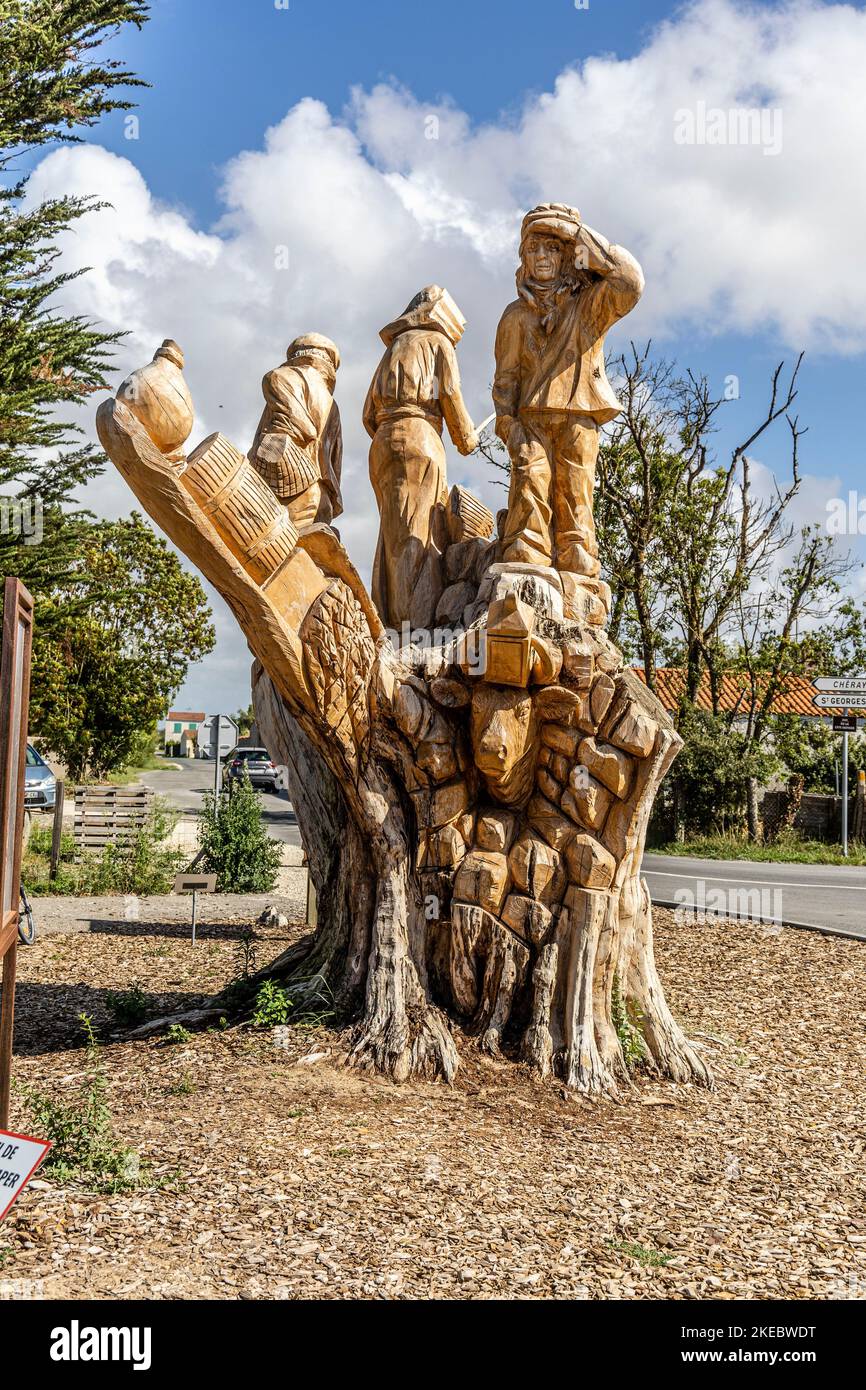Wood carving from a tree trunk on the roadside at Chaucre, Ile d ...