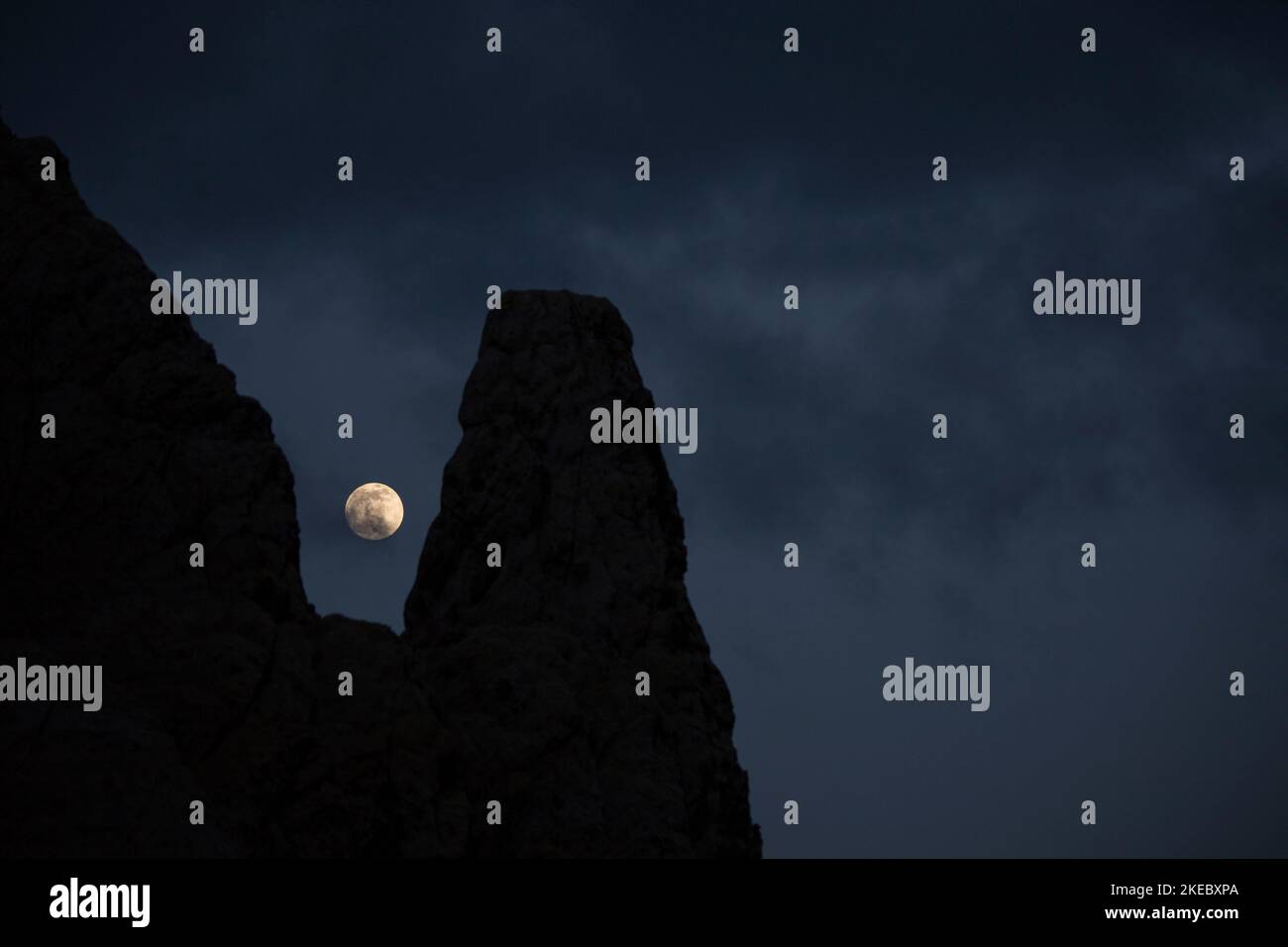 Moon between rocks Stock Photo - Alamy