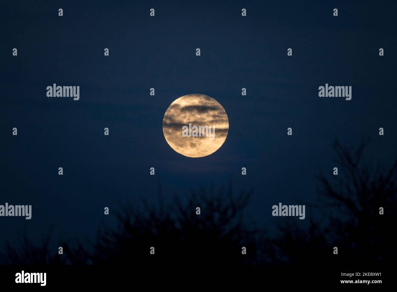 Full moon, clouds Stock Photo - Alamy