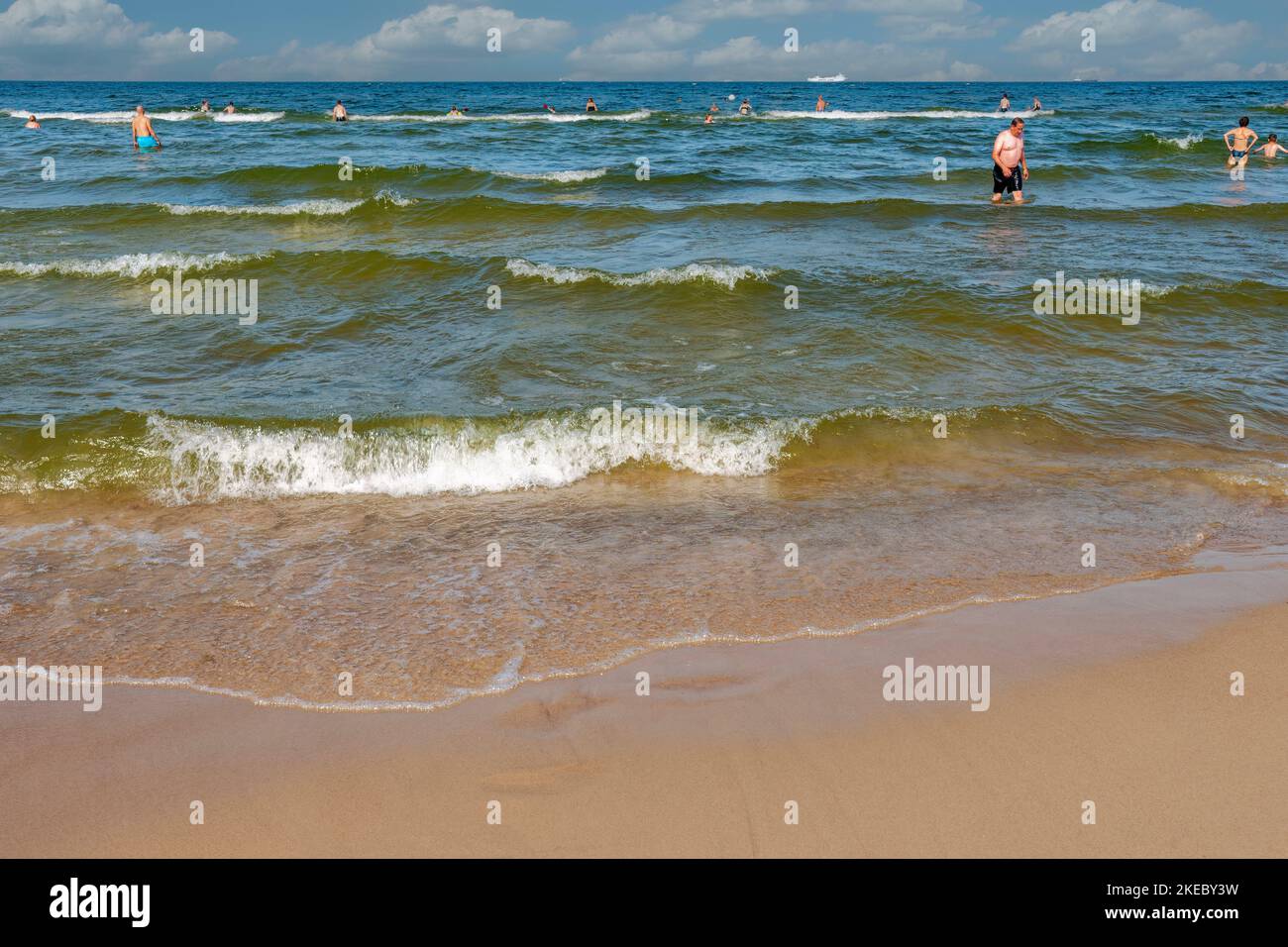 Sea waves and bathers on the beach of Ostseebad Ahlbeck, Usedom ...