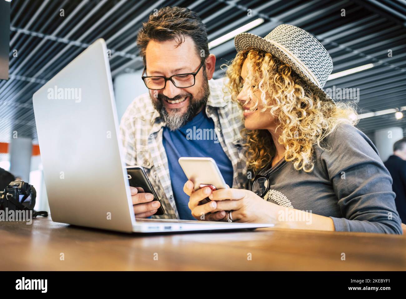 Travel and modern alternative place of work with laptop. Couple using ...