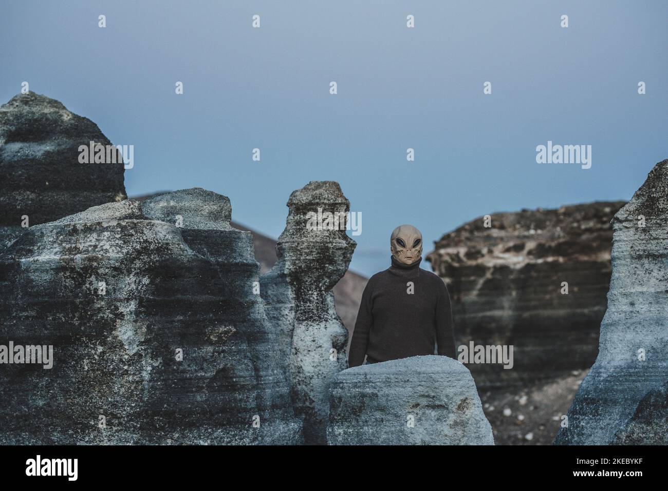 Standing alien mask people in moon style landscape. Concept of ...