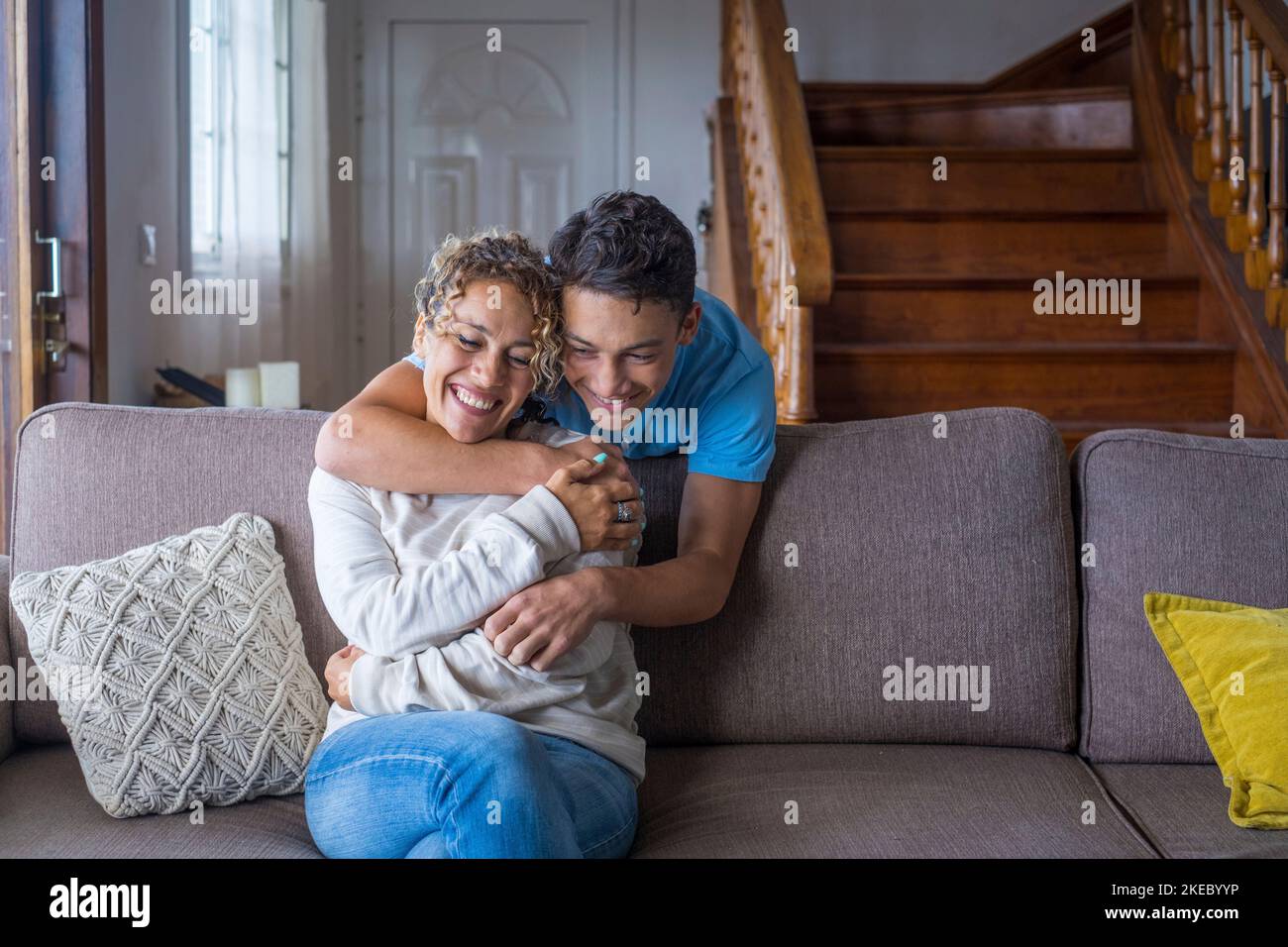 Happy middle age mother spend time with teenager son, relatives people ...