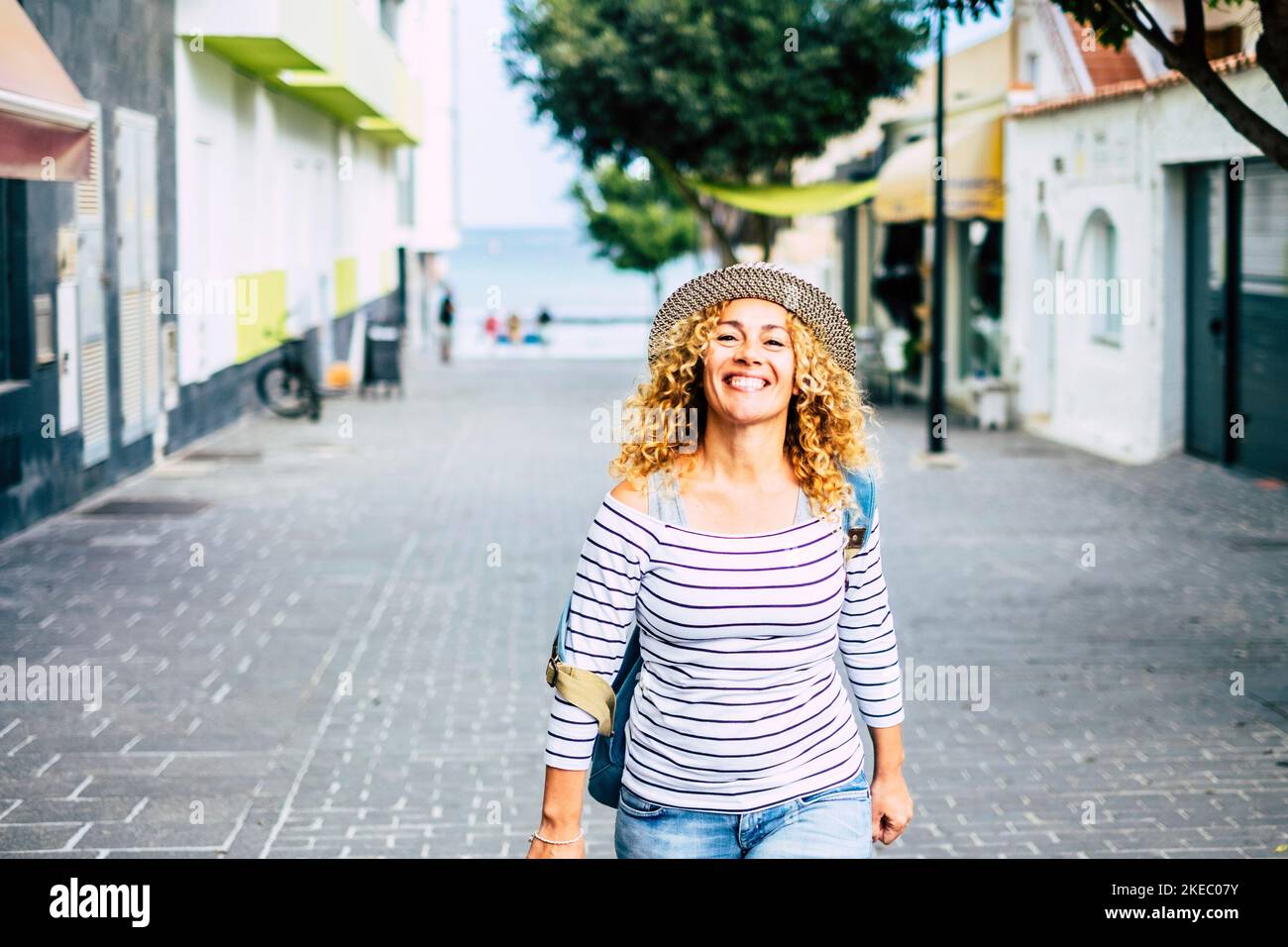 Beautiful woman walking street hi-res stock photography and images - Alamy