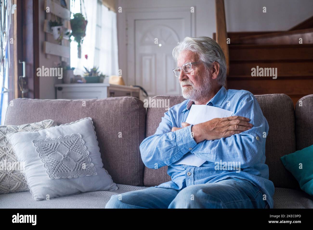 Sad elderly man reading health insurance deal closing looking and ...