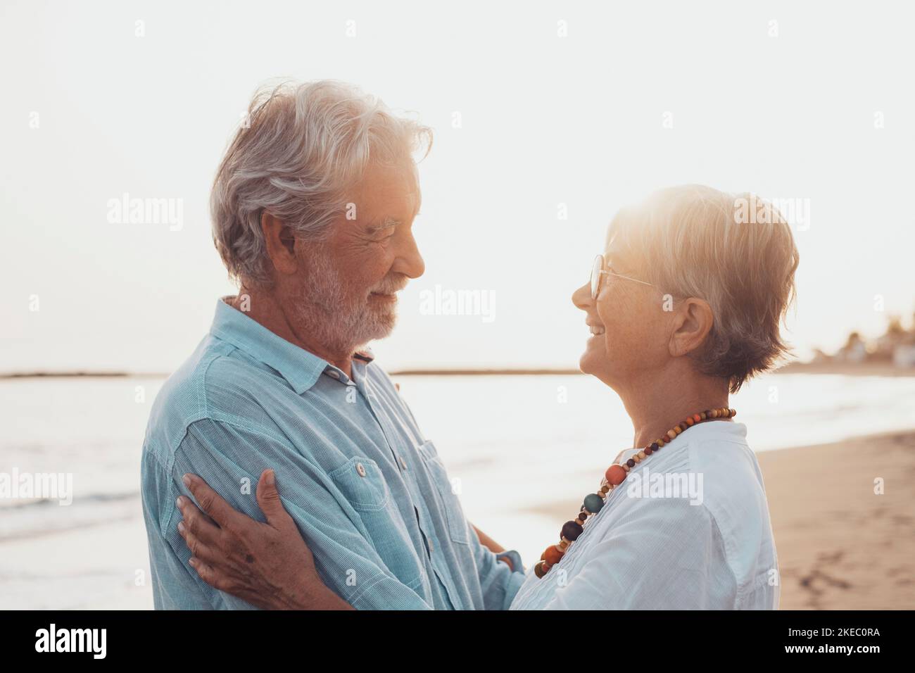 Close up of two cute and happy seniors having fun and enjoying together ...