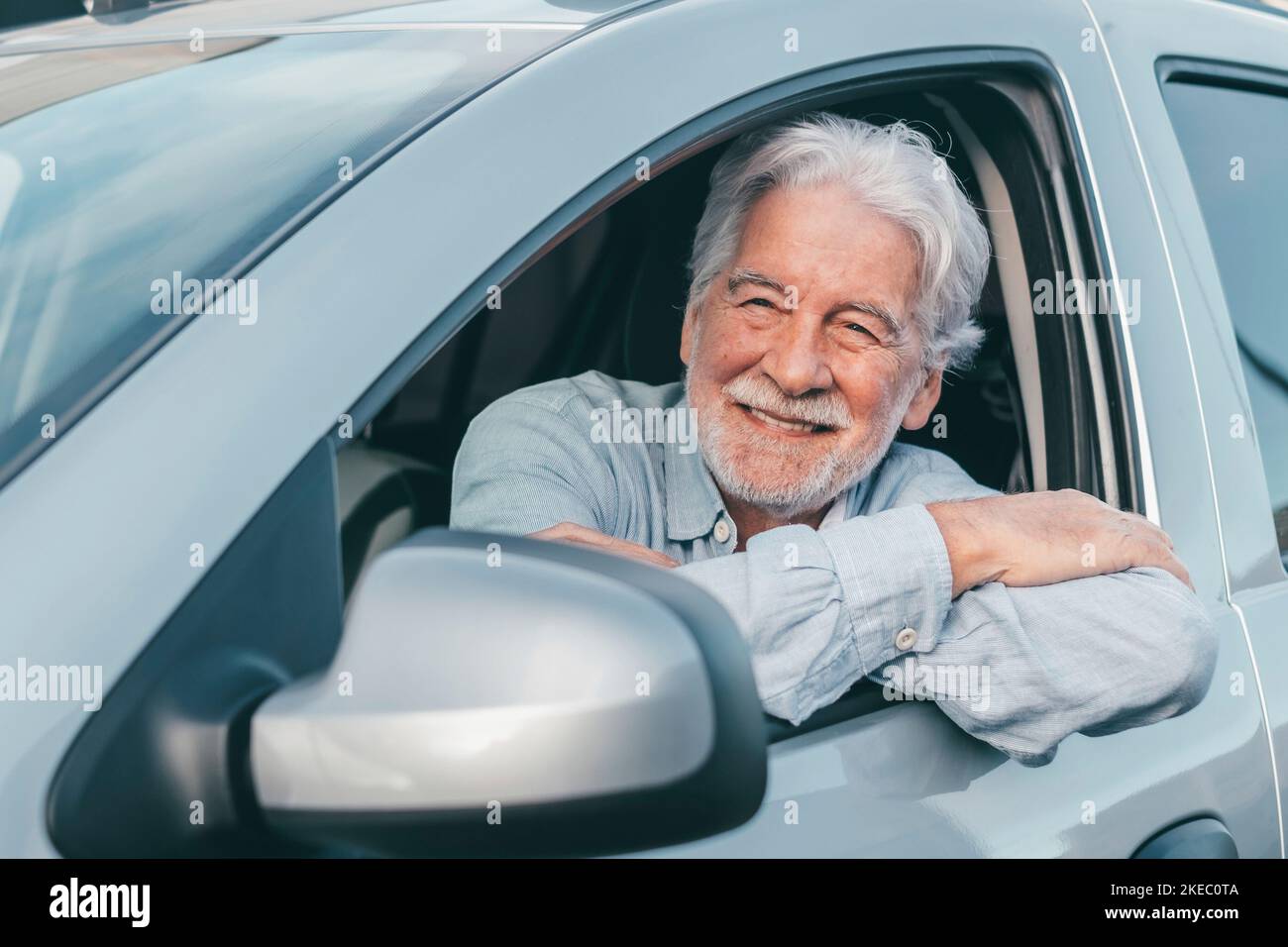 Happy owner looking at the camera with happy face. Handsome bearded ...