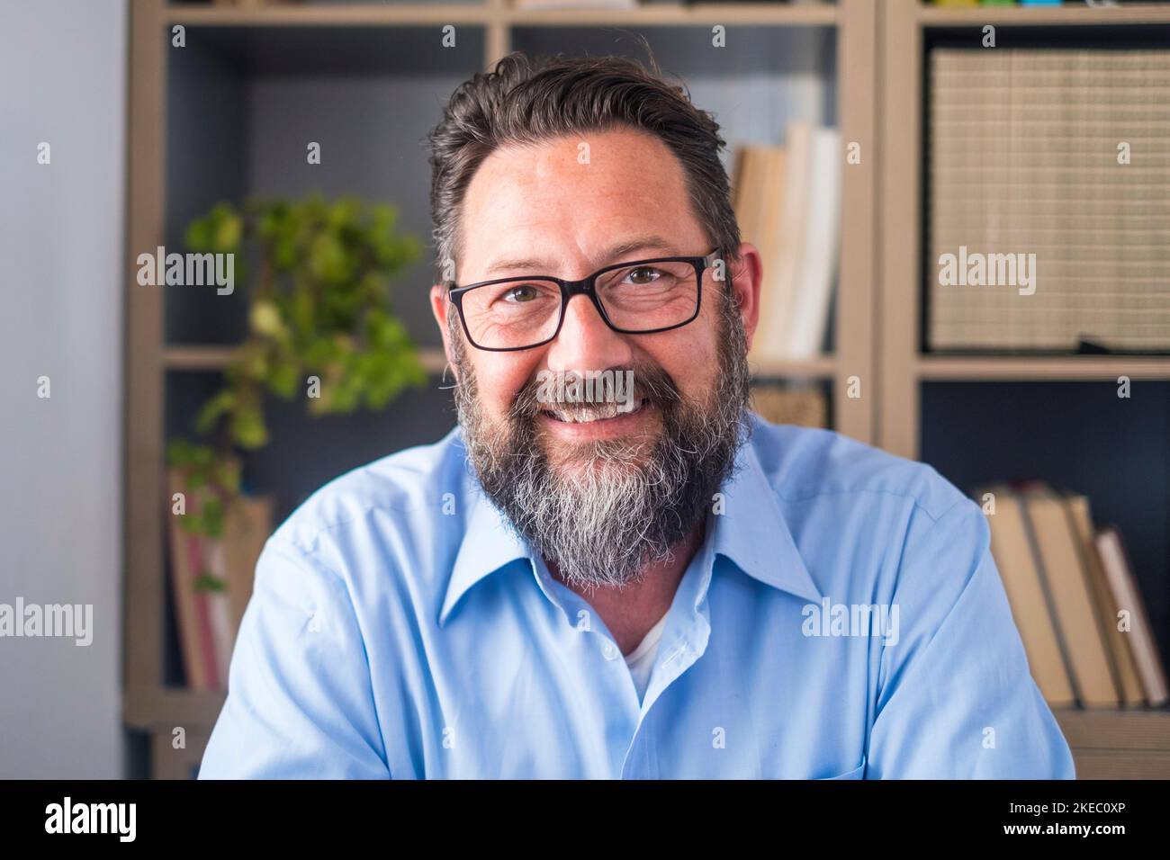 Portrait of one young and happy cheerful man smiling looking at the ...