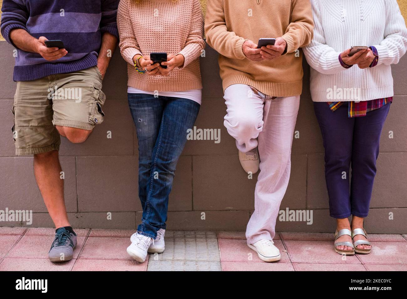 group of people using their cellphones and smartphones together and ...