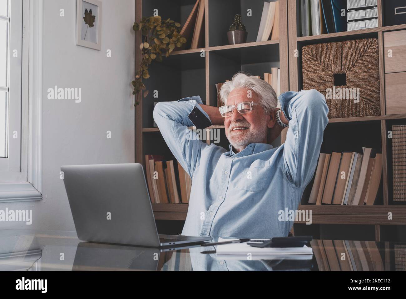 Happy satisfied caucasian mature man rest at home office sit with ...