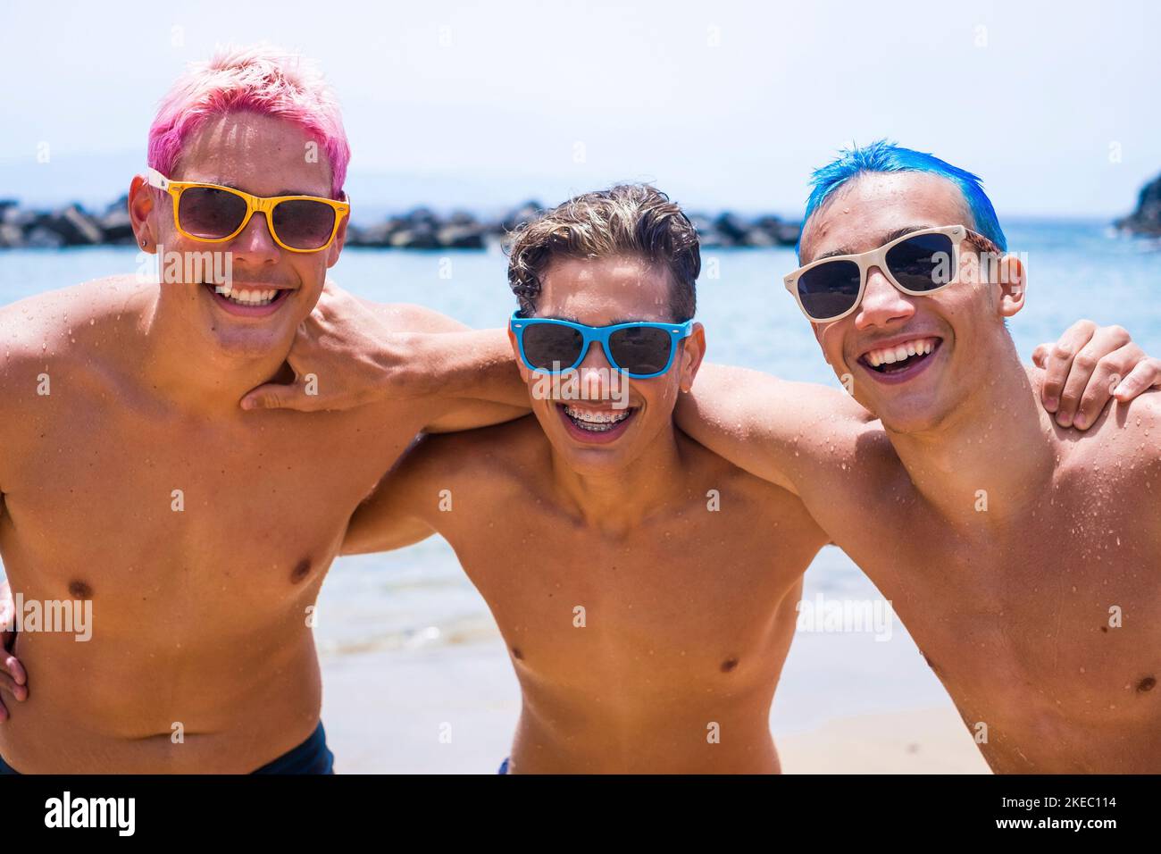 group of three friends having fun playing and enjoying together at the ...