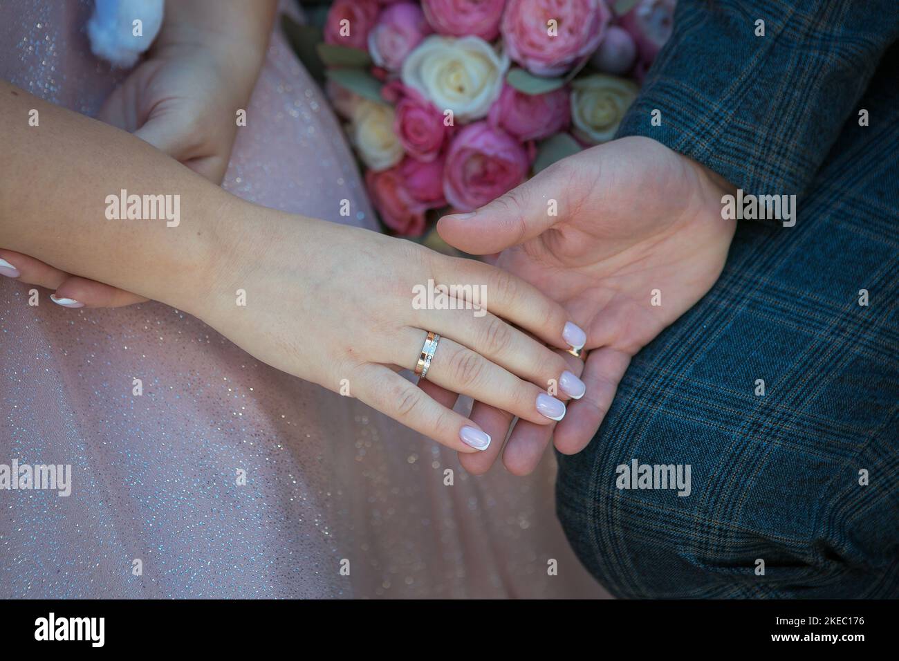 The bride and groom exchange wedding rings in the church during a ...