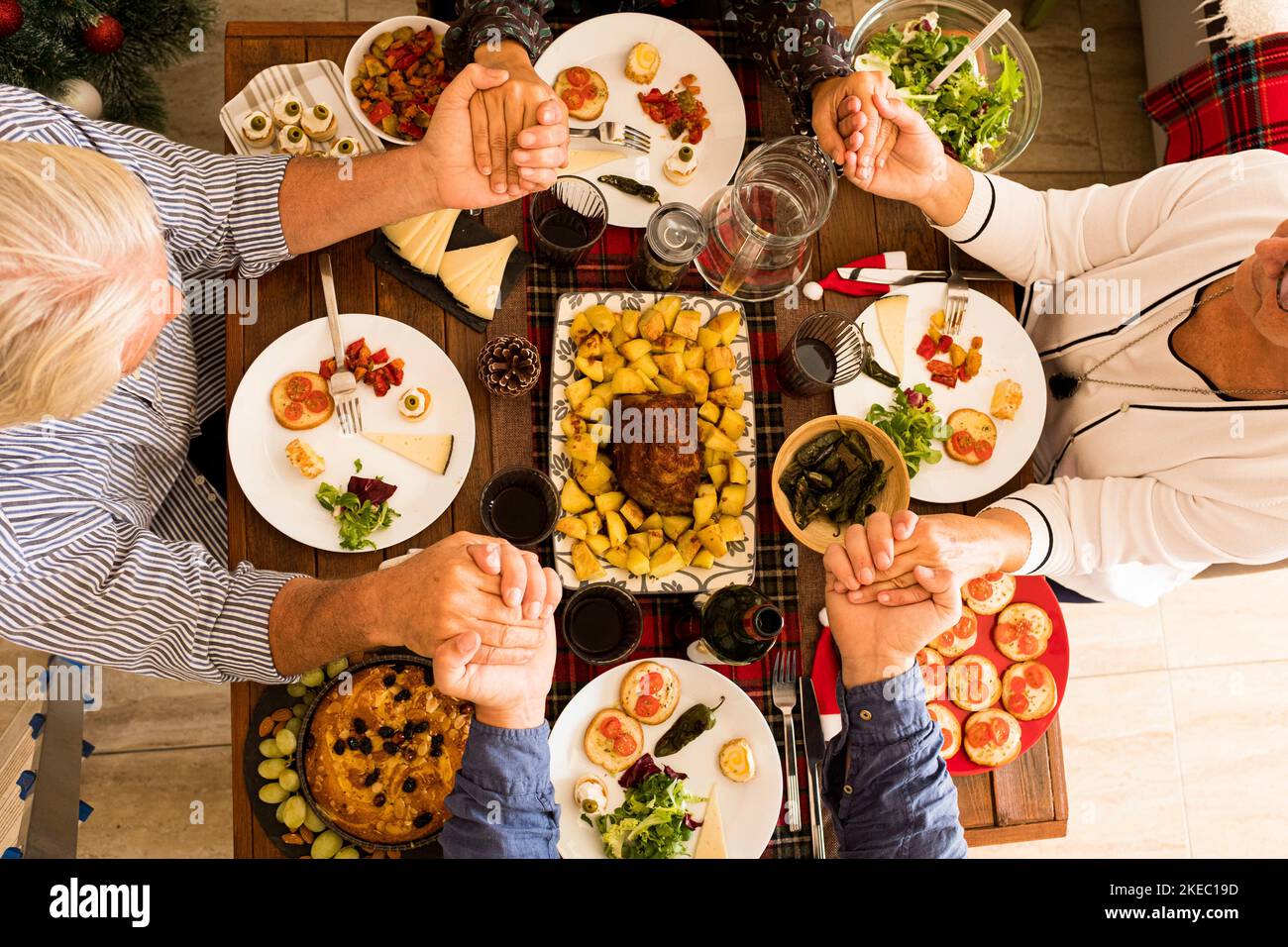 top and above view on a big wooden table full of food like chicken and ...