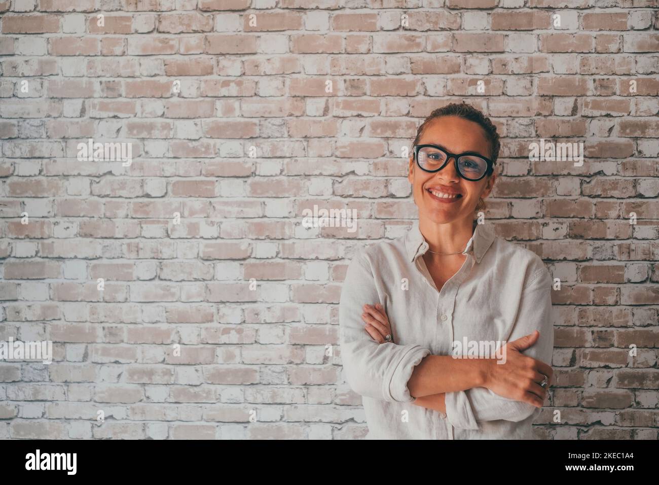 Portrait and close up of one happy and cheerful curly woman looking at ...