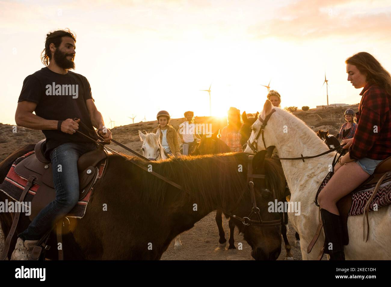Riding horses at sunset hi-res stock photography and images - Alamy