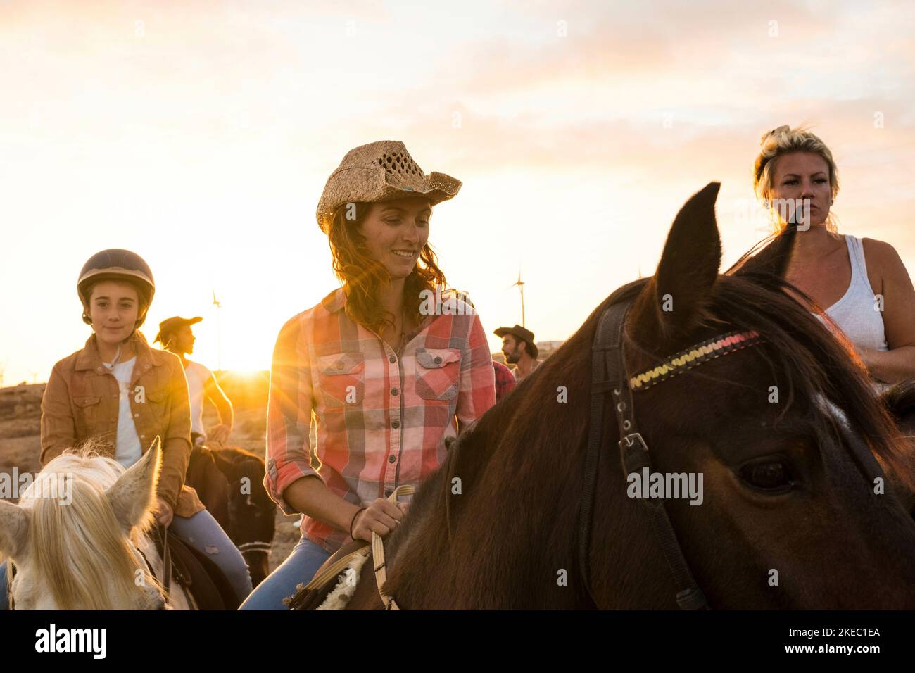 group of people riding on a horses together having fun and learning ...