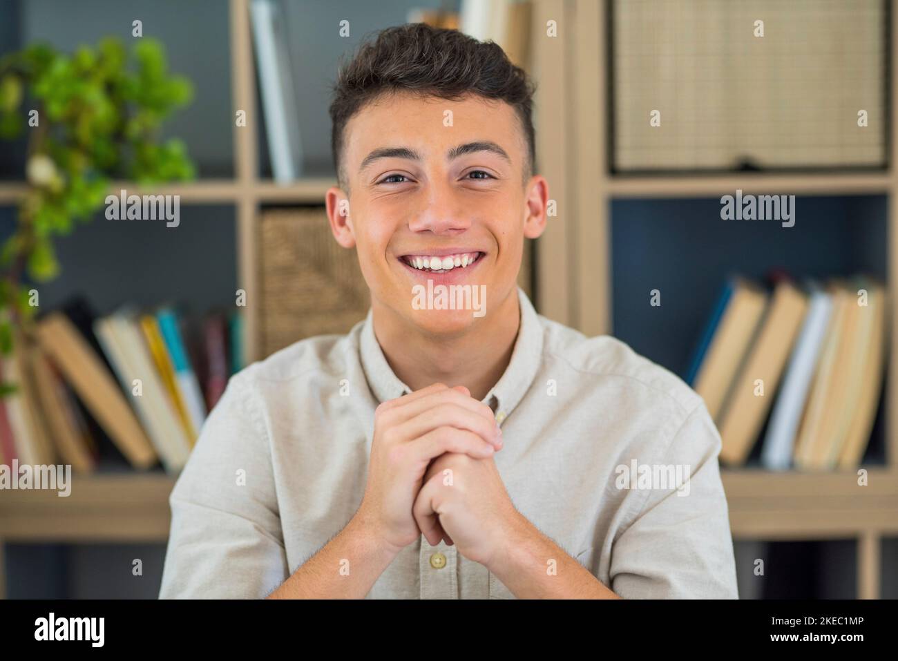 Portrait of one young and happy cheerful man smiling looking at the ...