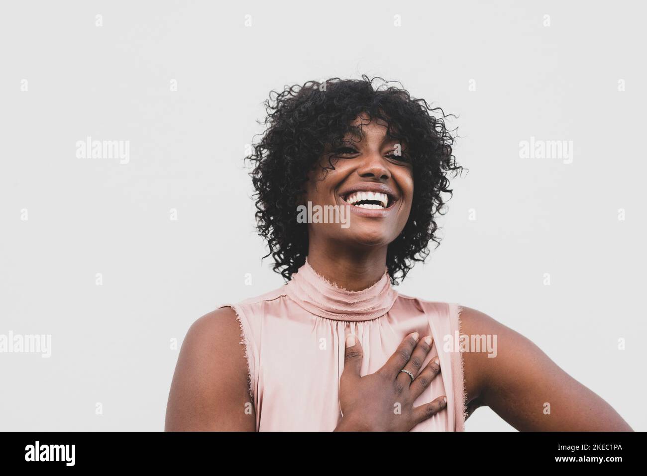 close up and portrait of beautiful afro woman smiling and laughing with ...