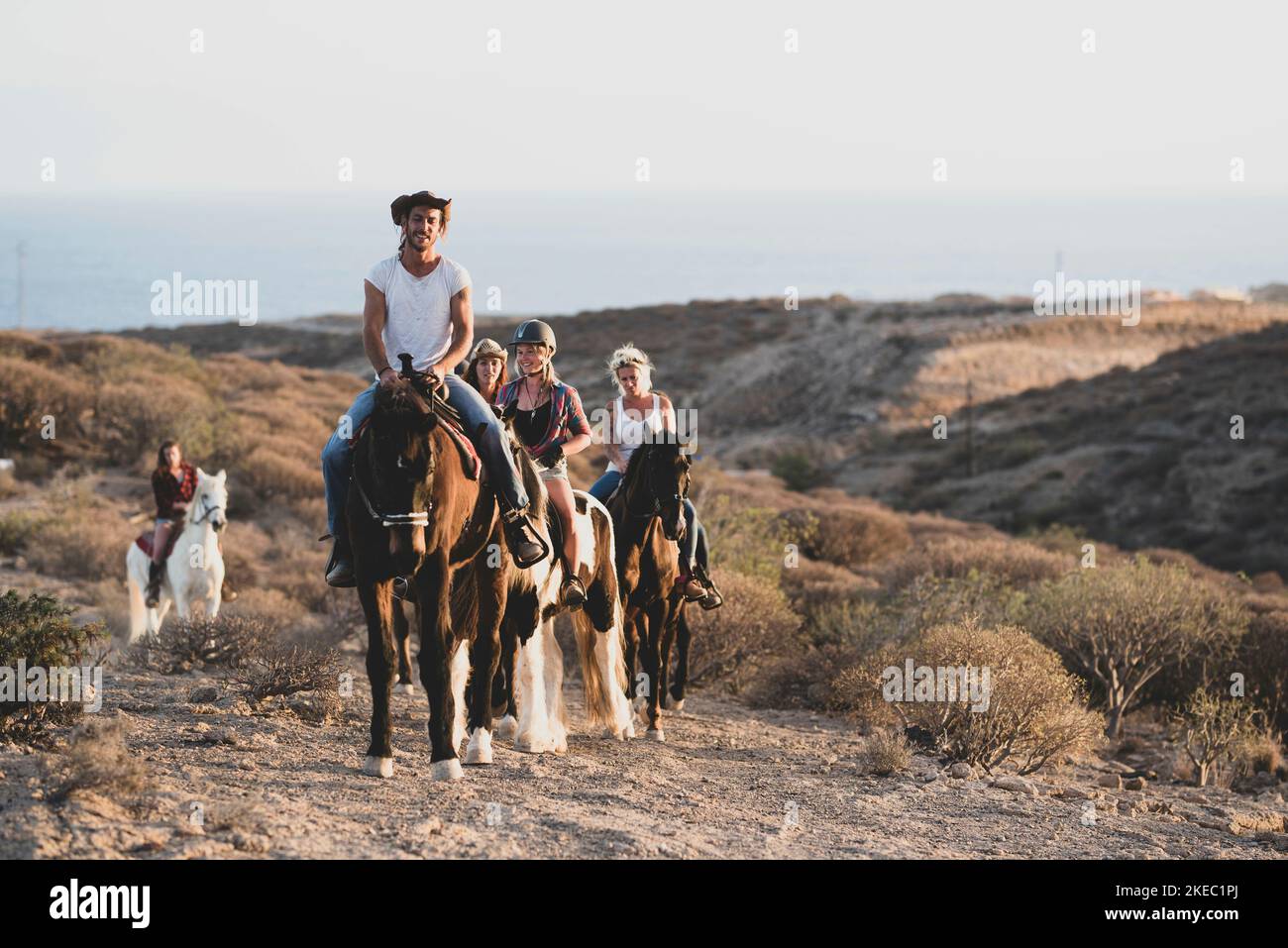 group of people riding on a horse together walking and discovering new ...