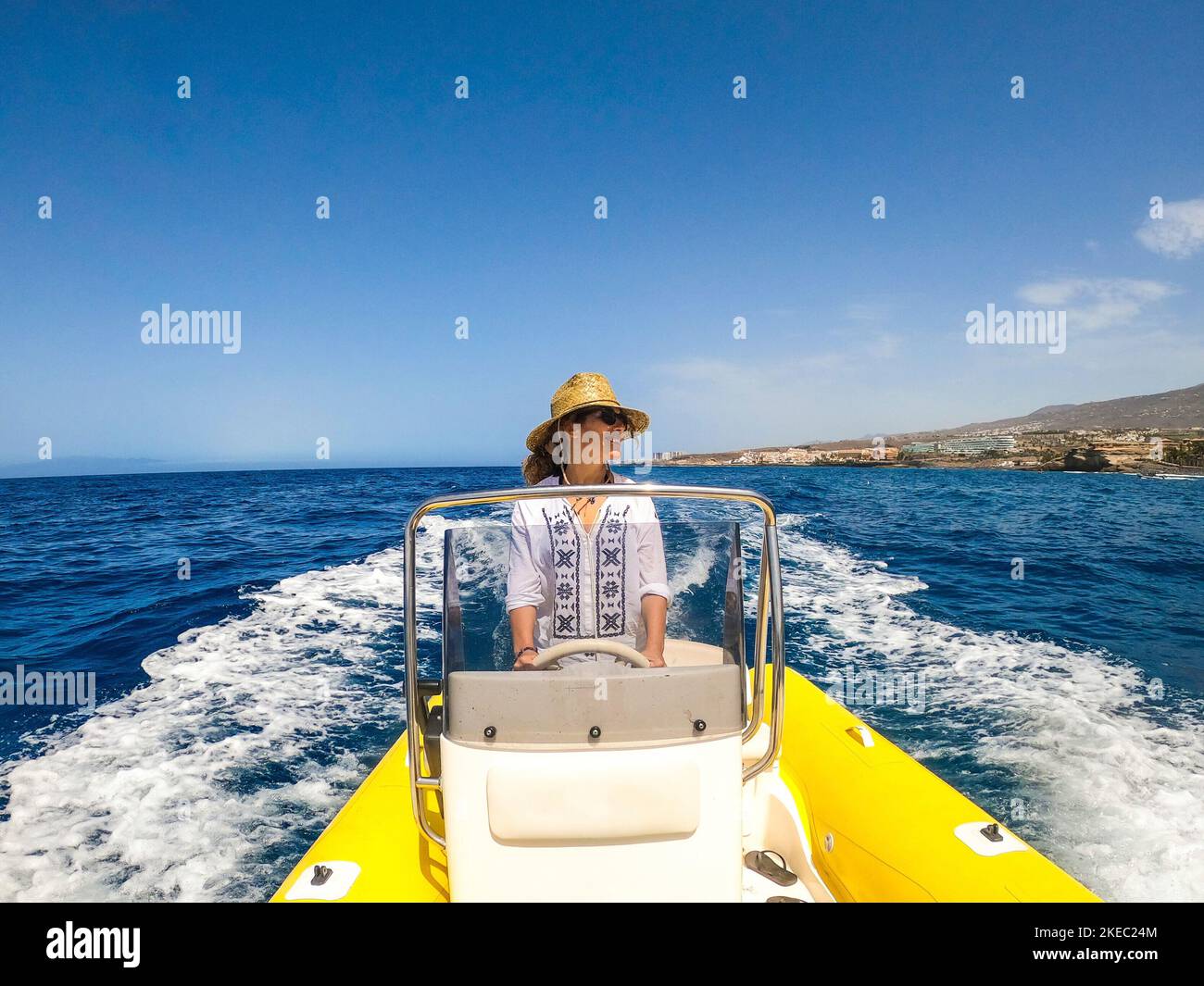 Woman driving boat hi-res stock photography and images - Alamy