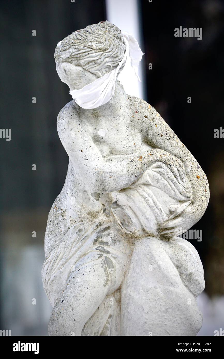 a statue wearing a mask Stock Photo - Alamy