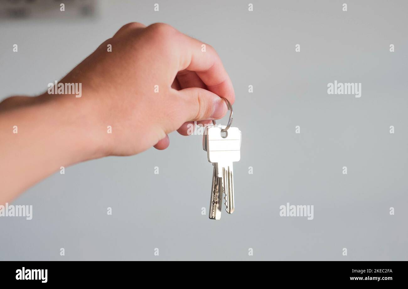 Hand holding keys hi-res stock photography and images - Alamy