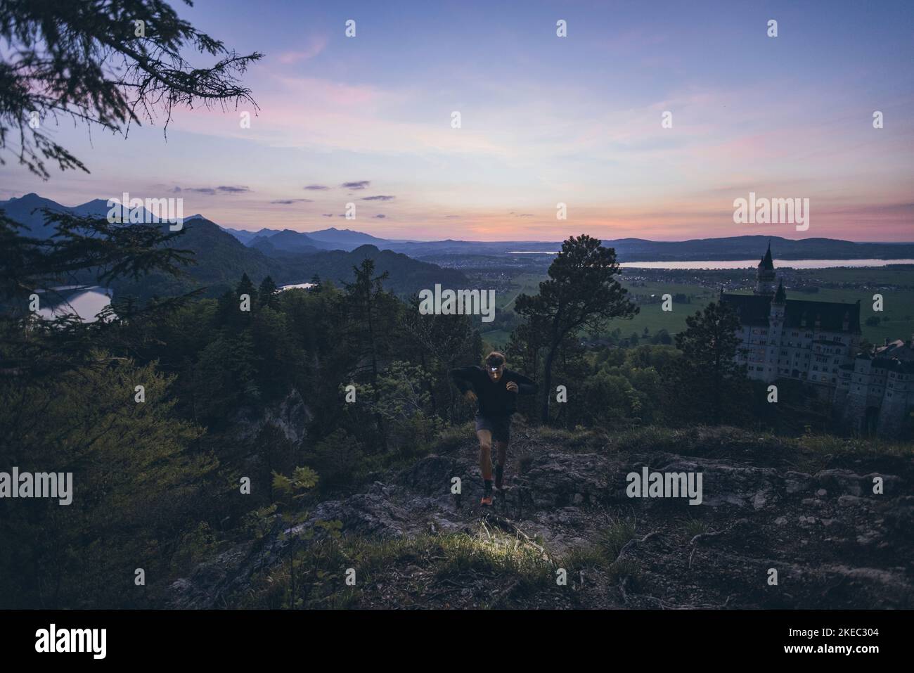 Man running, Neuschwanstein castle in the background Stock Photo - Alamy