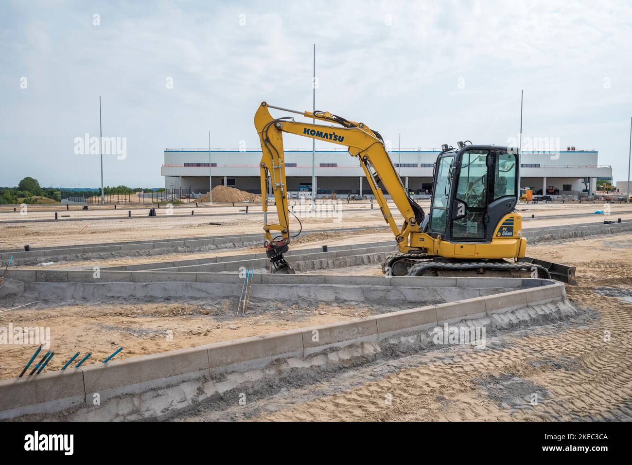 Construction site with excavator in summer Stock Photo - Alamy