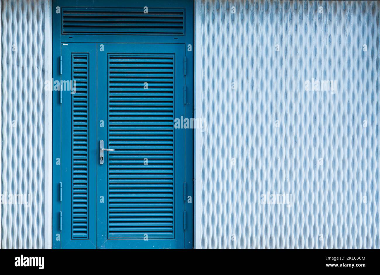 A blue louvered door of the house Stock Photo - Alamy