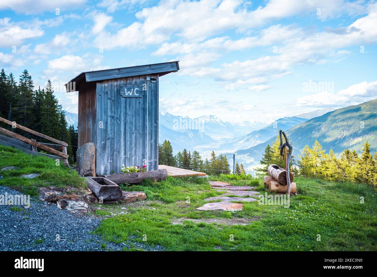 Toilet house on a mountain pasture overlooking the valley in the Alps ...