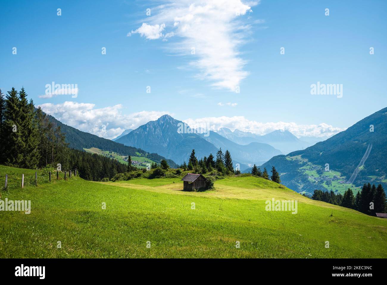 Alpine pasture with wooden hut in the Alps in Austria in summer daytime ...
