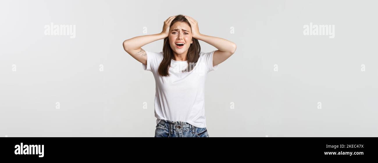 Miserable and shocked young girl panicking, looking alarmed Stock Photo ...