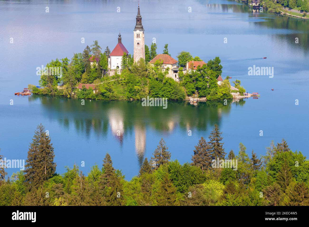 View of lake Bled at in spring with the small island and Assumption of ...